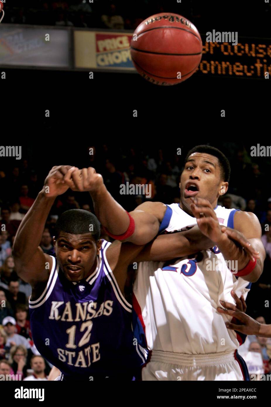 Kansas State guard Fred Peete (12) and Kansas forward Wayne Simien ...