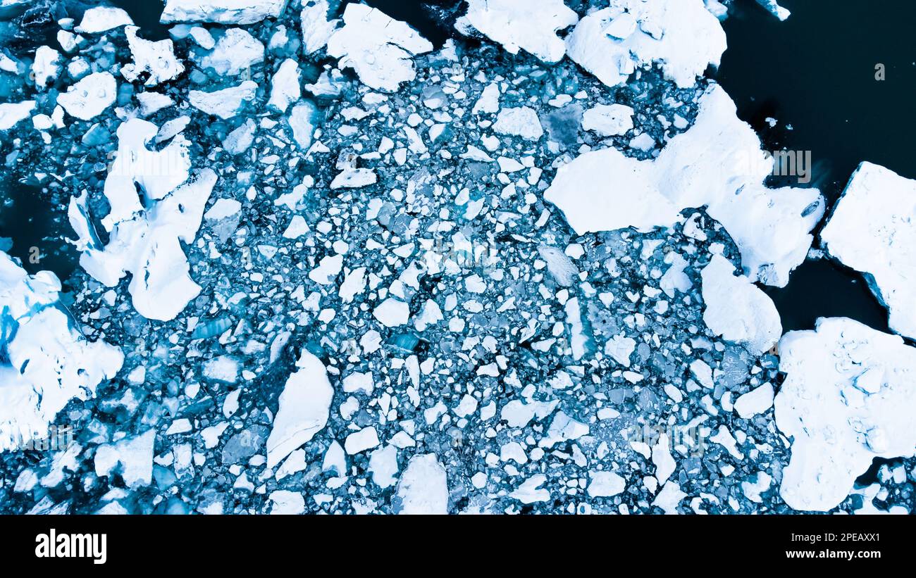 Melting Arctic ice in ocean water. Snow covered Blue glacier ice in ...