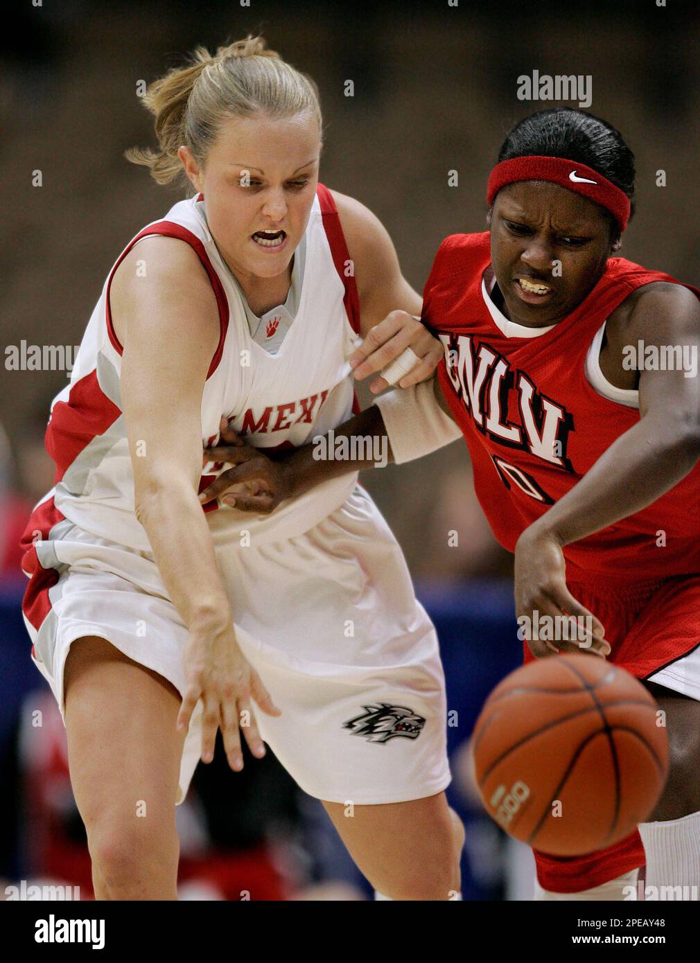 UNLV guard Sheena Moore, right, and New Mexico guard Katie Montgomery ...