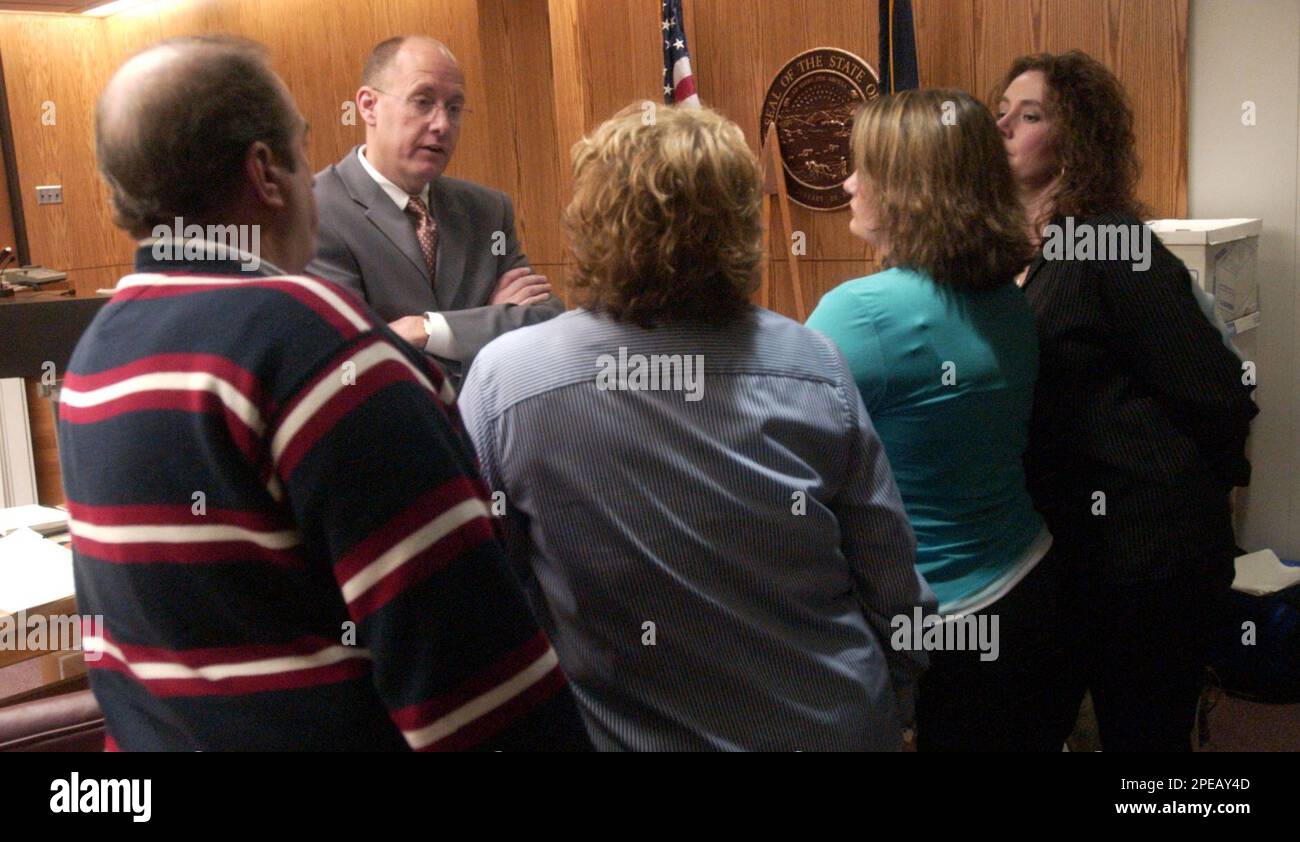 Assistant district attorney Tom Bath, second from left, facing camera ...
