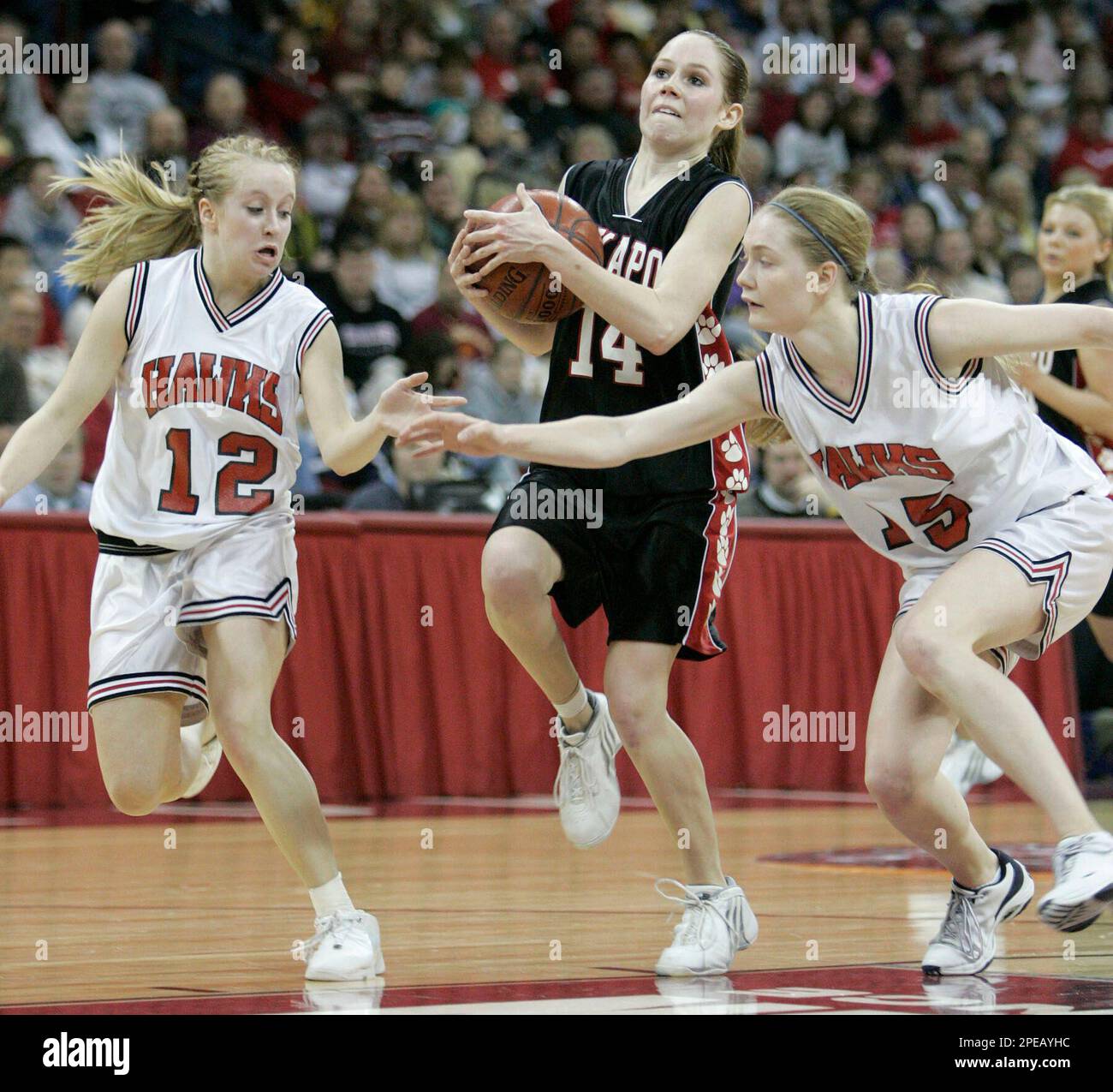 Kickapoo's Janelle Burnham (14) tries to cut through Owen-Withee's ...