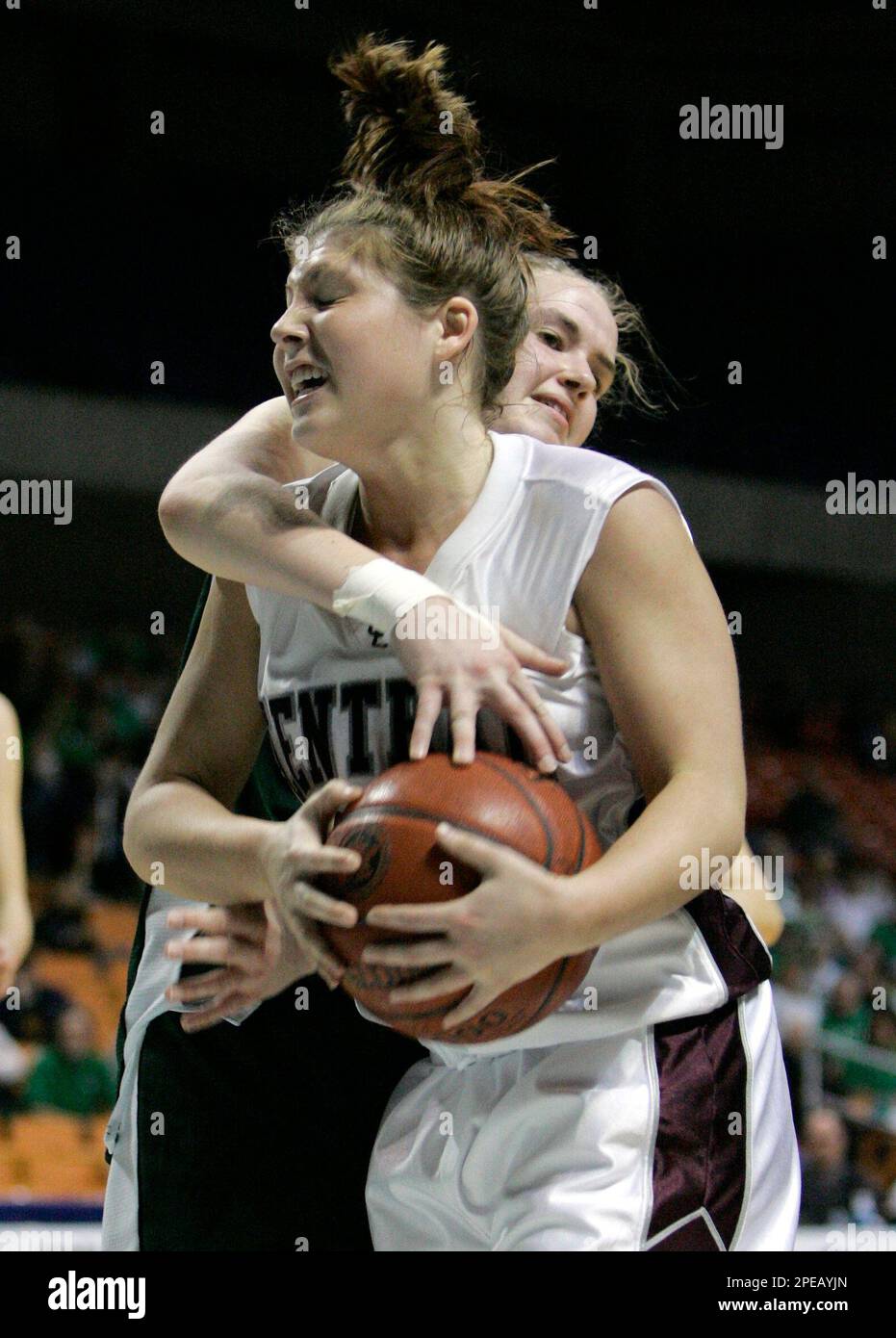 Wheeling Central's Kayleen Fitzsimmons, wearing white, is fouled from ...