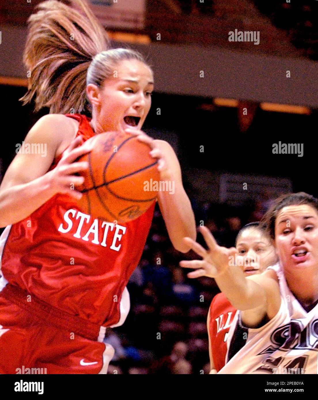 Illinois State's Katie Donovan, left, pulls down a rebound while going ...