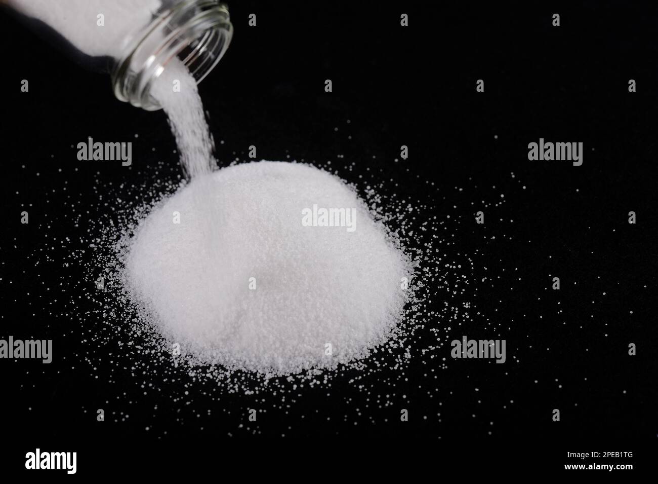 salt crystals pouring from the glass salt shaker Stock Photo - Alamy