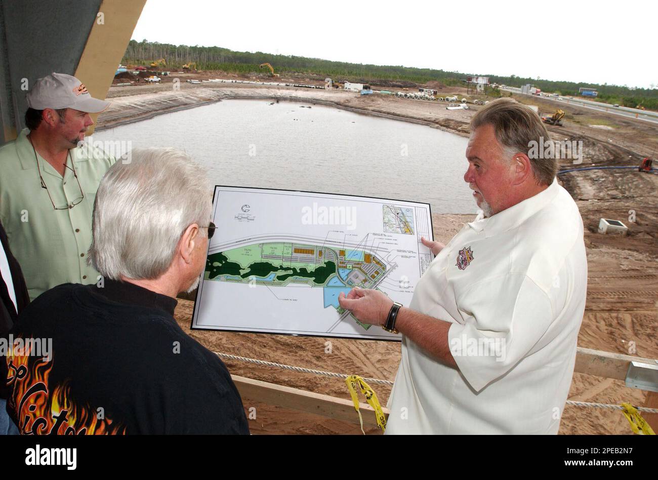 Bruce Rossmeyer, right, shows Steve Penland, left, and Arlen Ness, the ...