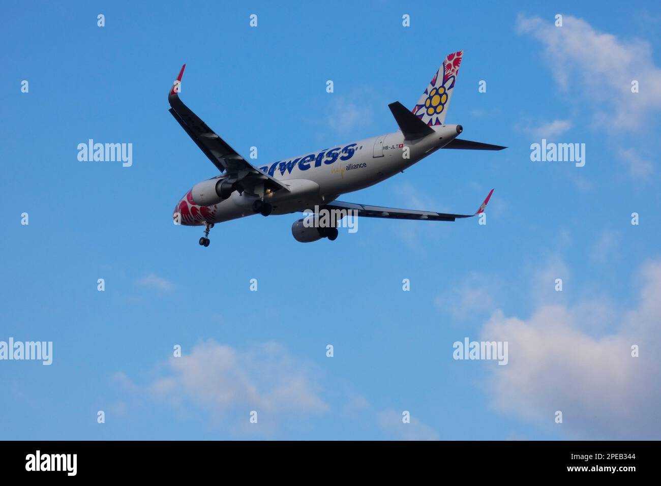 Commercial aircraft overflying the sky and arriving at airport Stock ...
