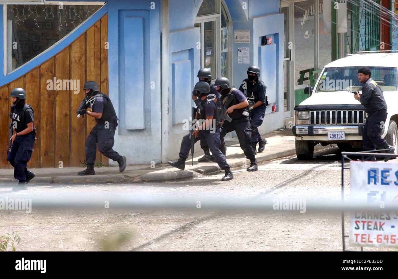 An assault team of Costa Rican police prepare to take the local branch ...