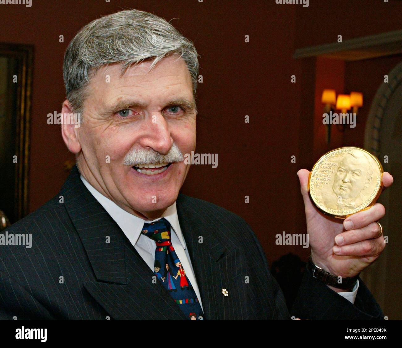 Retired Lt. Gen. Romeo Dallaire displays the Pearson Peace Medal he was ...