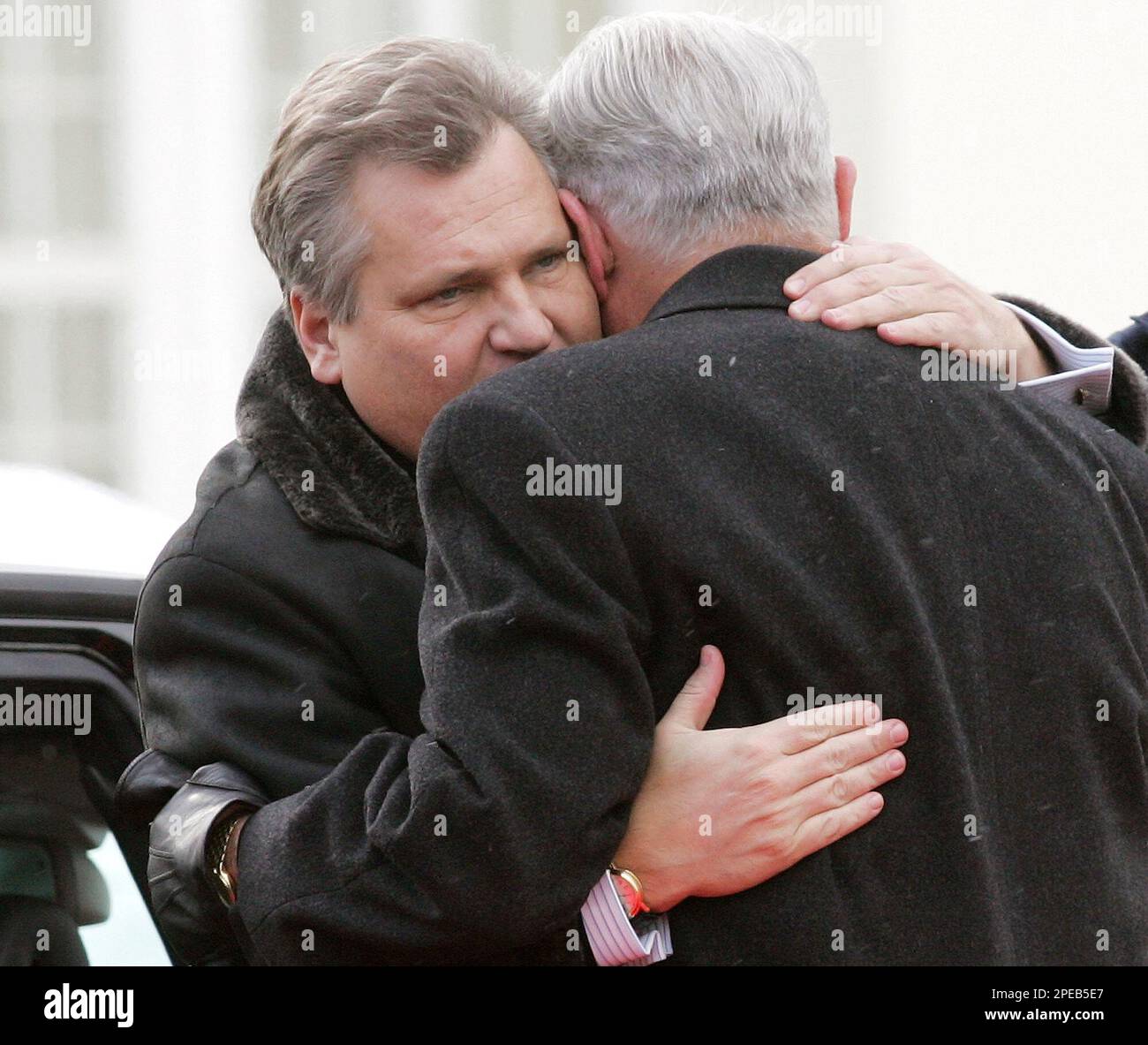 Polish President Aleksander Kwasniewski, left , embraces the Lithuanian ...
