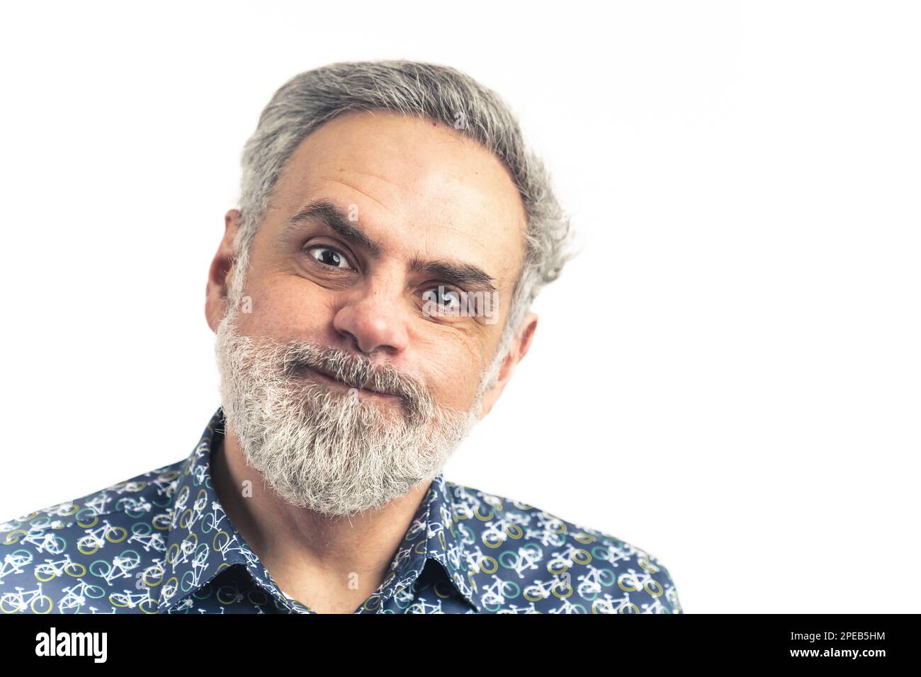 Middle-aged bearded man in a blue shirt making a funny face with ...