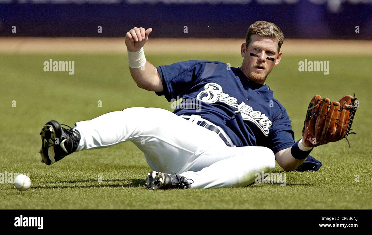 Milwaukee Brewers right fielder Geoff Jenkins can't come up with a ball ...