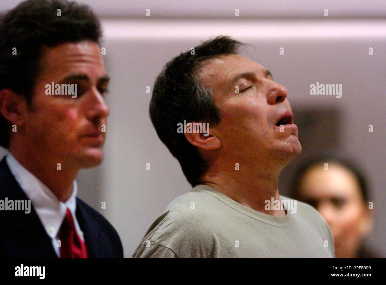 Defendant Erwin Howard, right, stands with his attorney, Andrew Flier ...