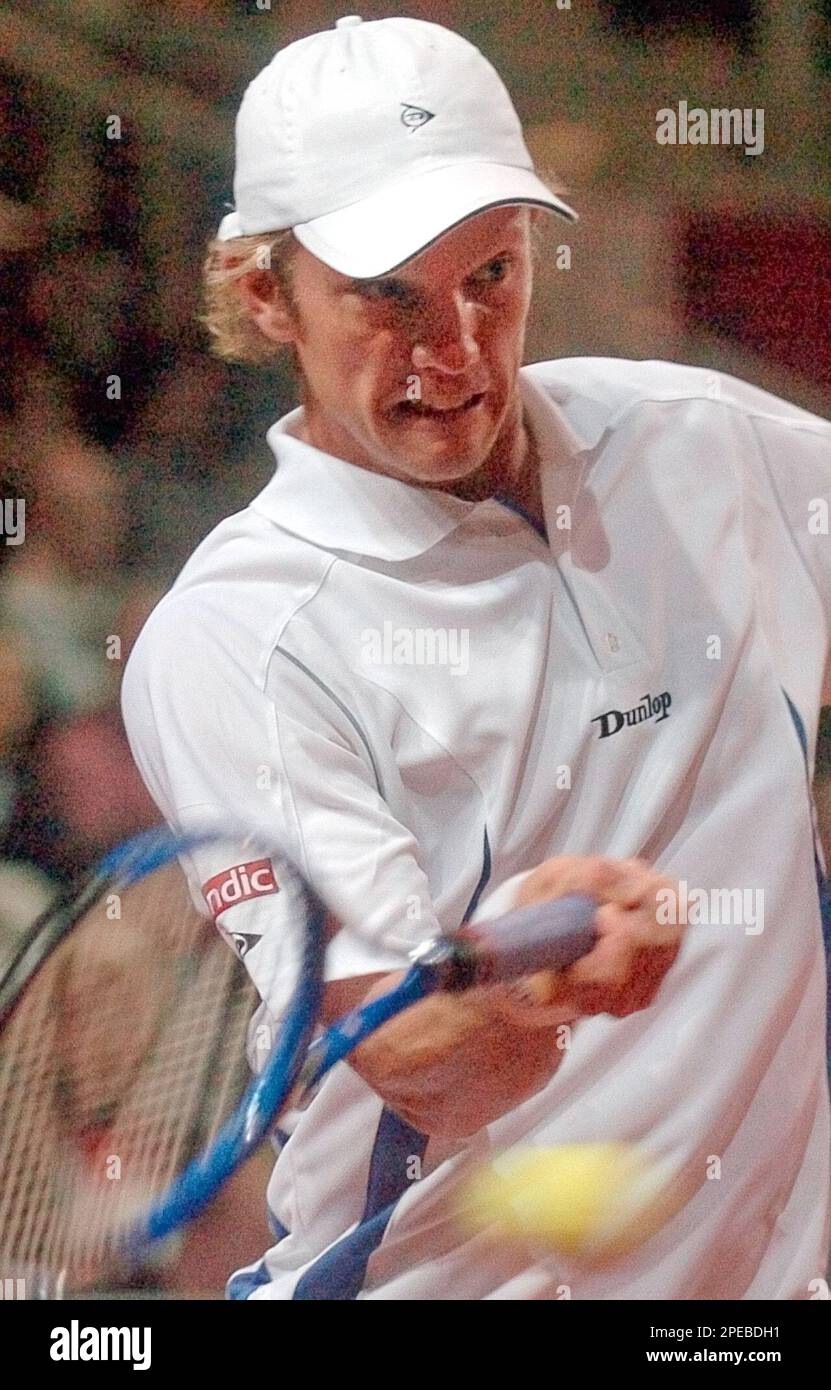 Sweden's Thomas Johansson returns a forehand shot to France's Paul ...