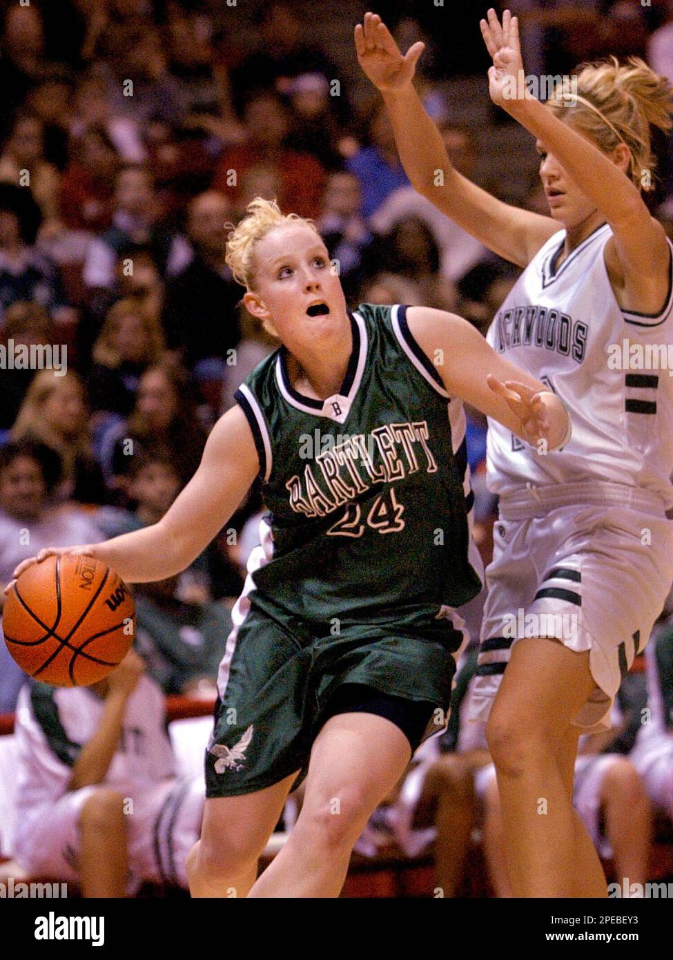 Bartlett's Lindsay Schrader, left, drives through Peoria Richwoods ...