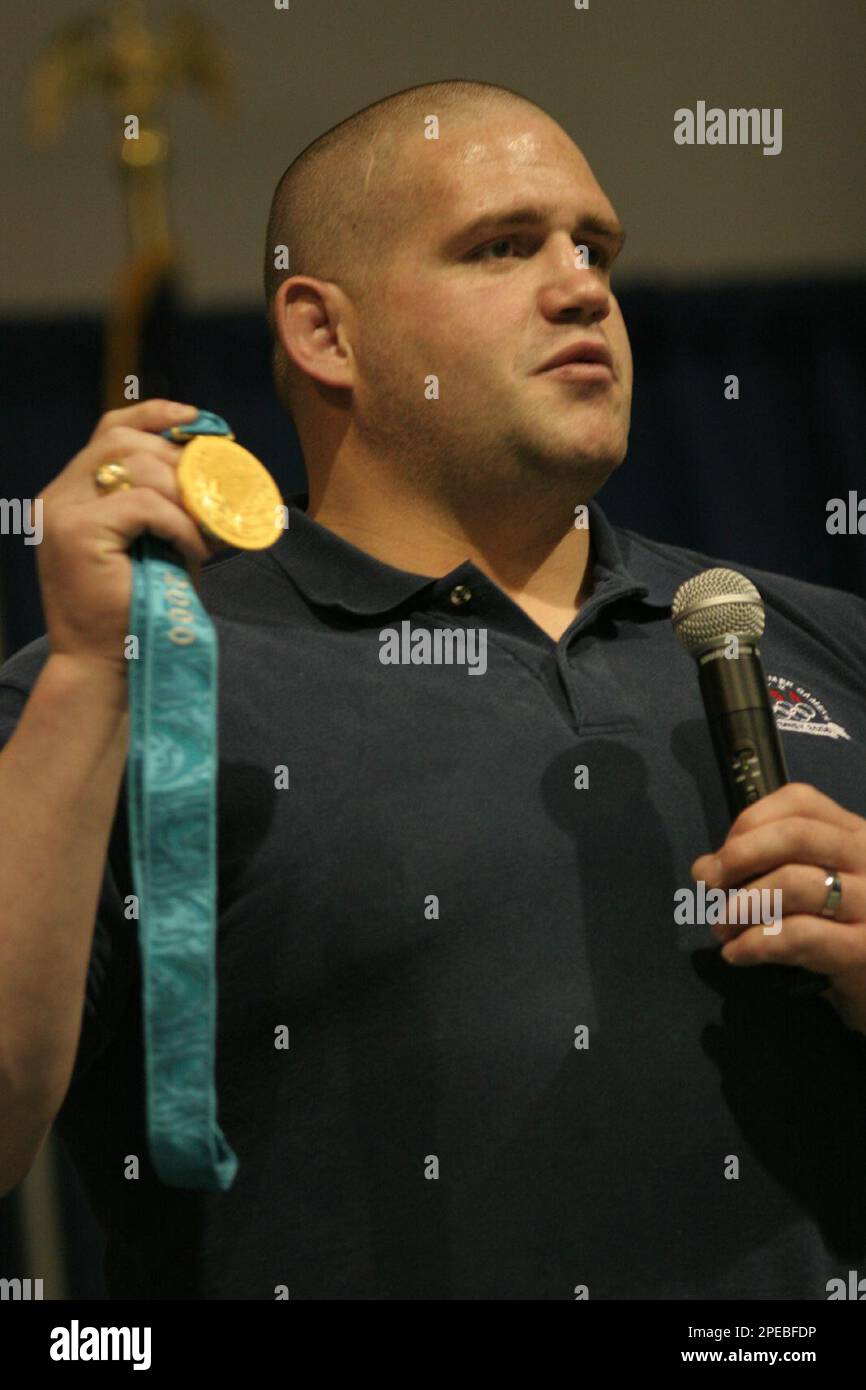Olympic gold and bronze medalist Rulon Gardner holds the gold medal he ...