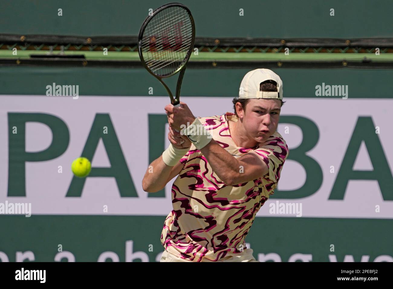 Jagger Leach returns a shot to Stiles Brockett at the BNP Paribas Open ...