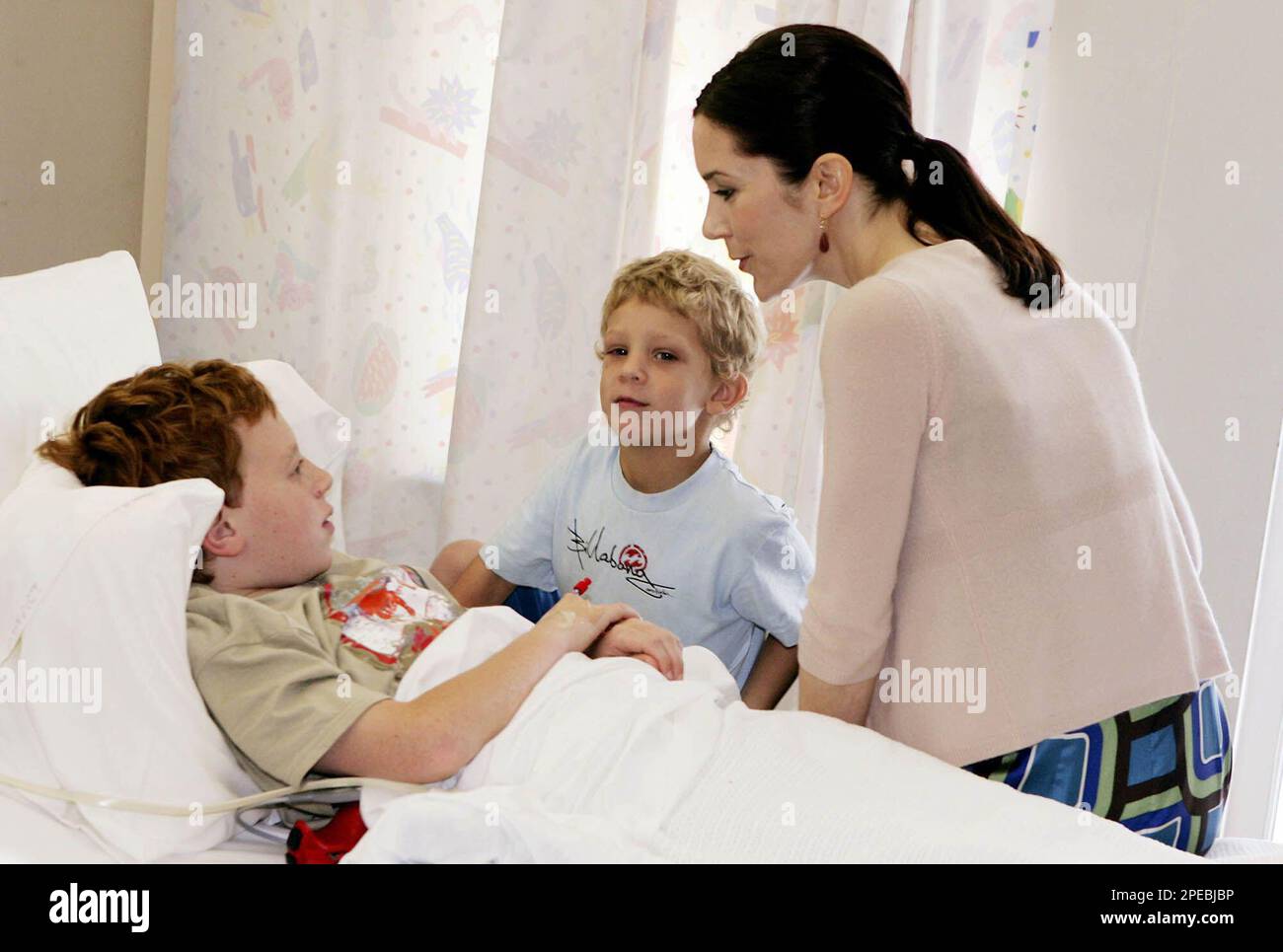 Crown Princess Mary of Denmark, left, talks to Jerome McCready, left ...