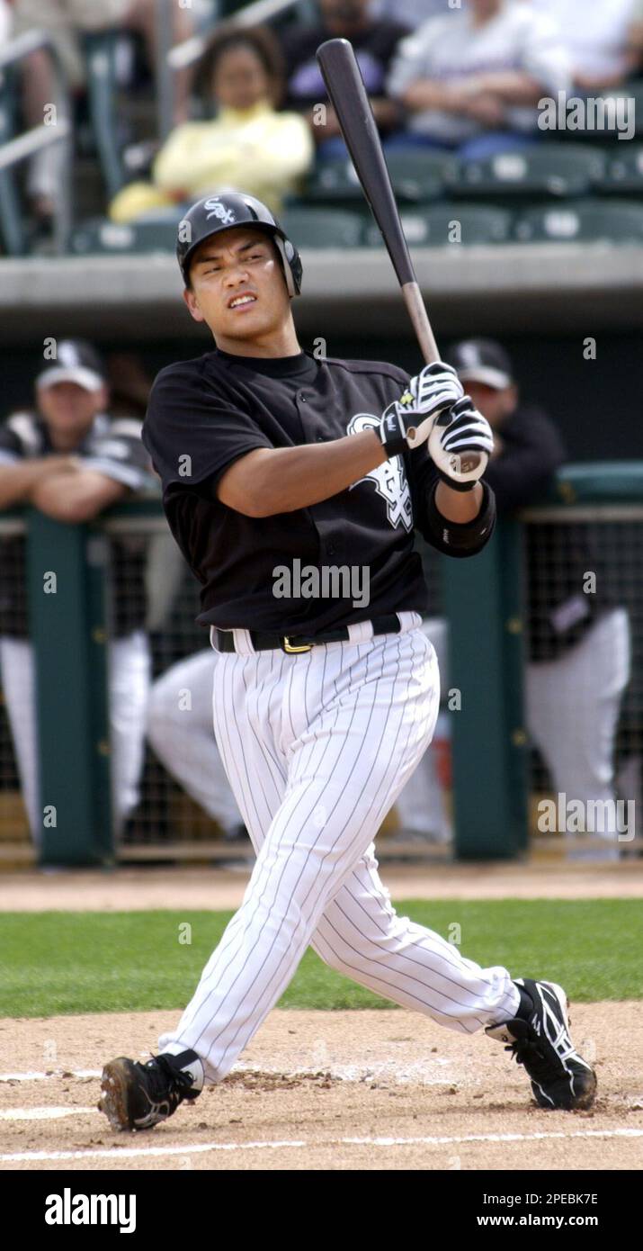 Chicago White Sox second baseman Tadahito Iguchi takes a full swing at ...