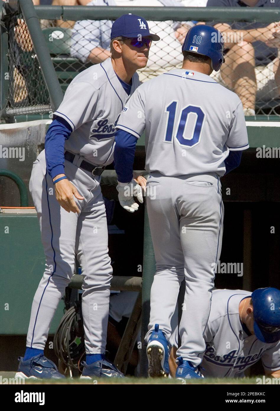 Los Angeles Dodgers manager Jim Tracy, left, greets Jose Valentin ...