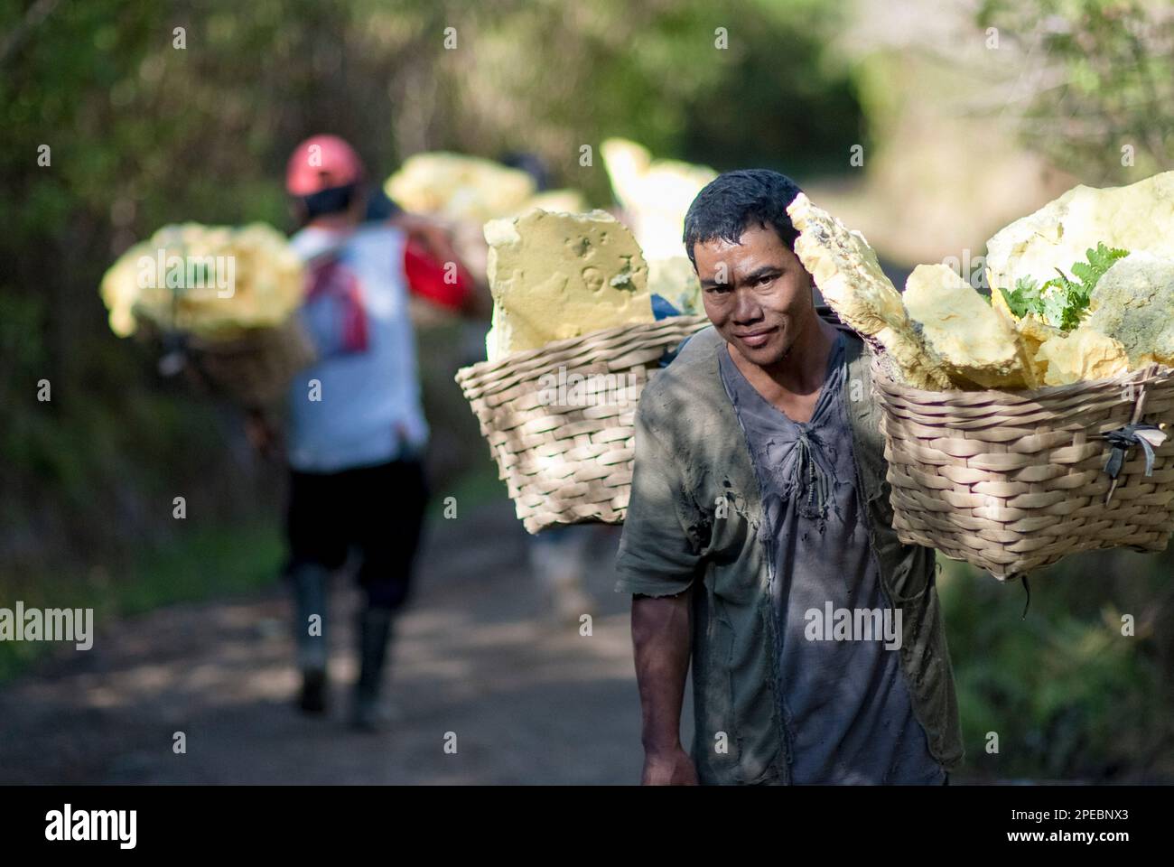 Two men carrying baskets hi-res stock photography and images - Alamy