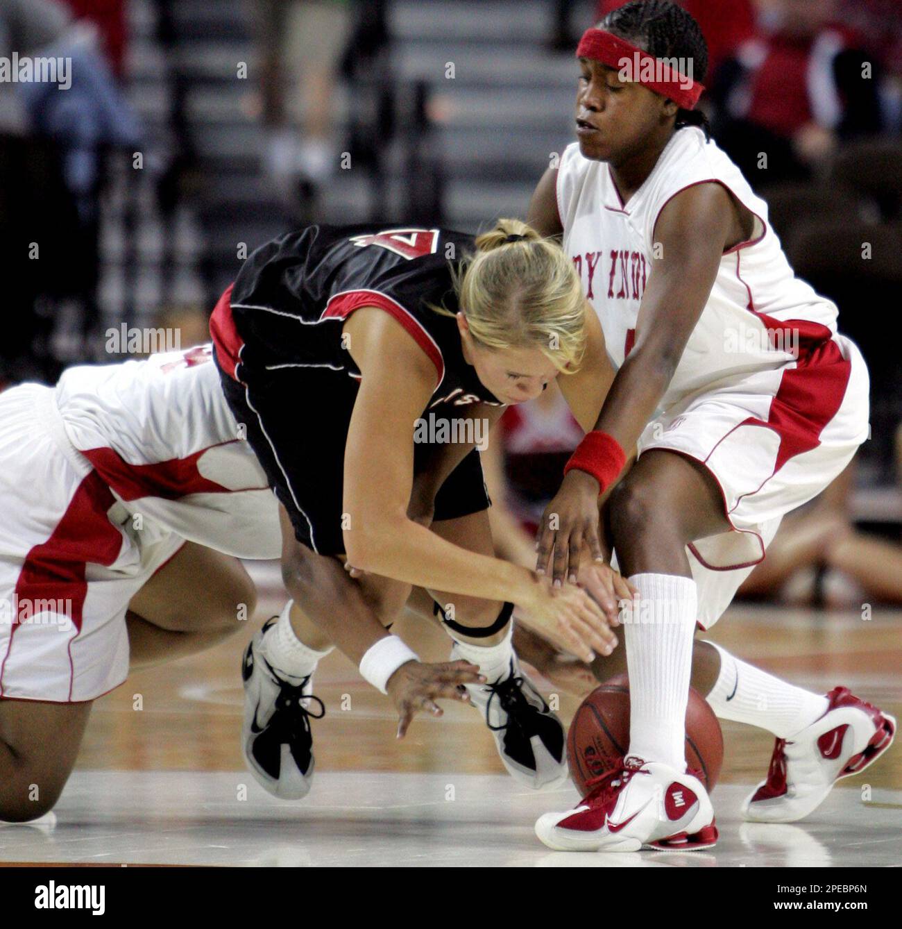 Winnsboro's Whitney Huffman, center, loses control of the ball as she ...
