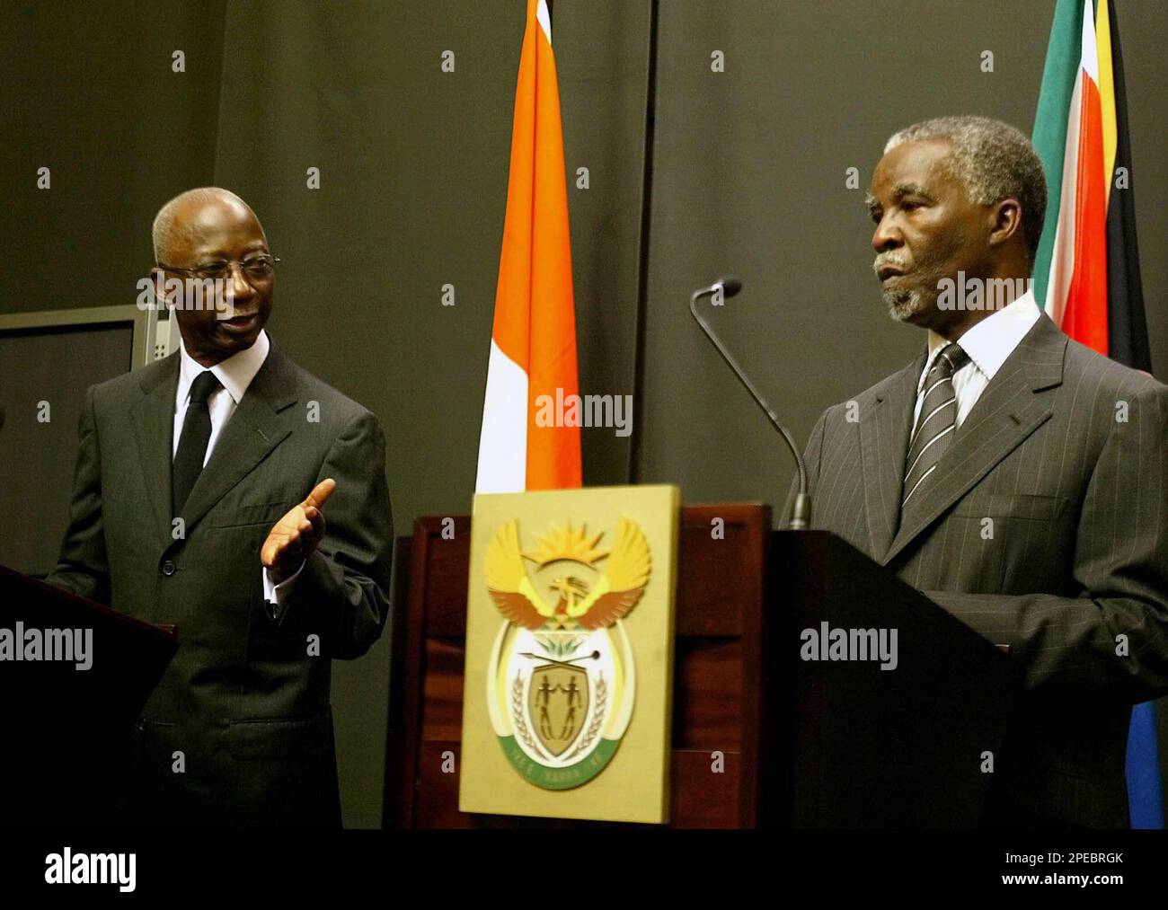 Ivory Coast prime minister, Seydou Diarra, left, makes his point to the South African president ...