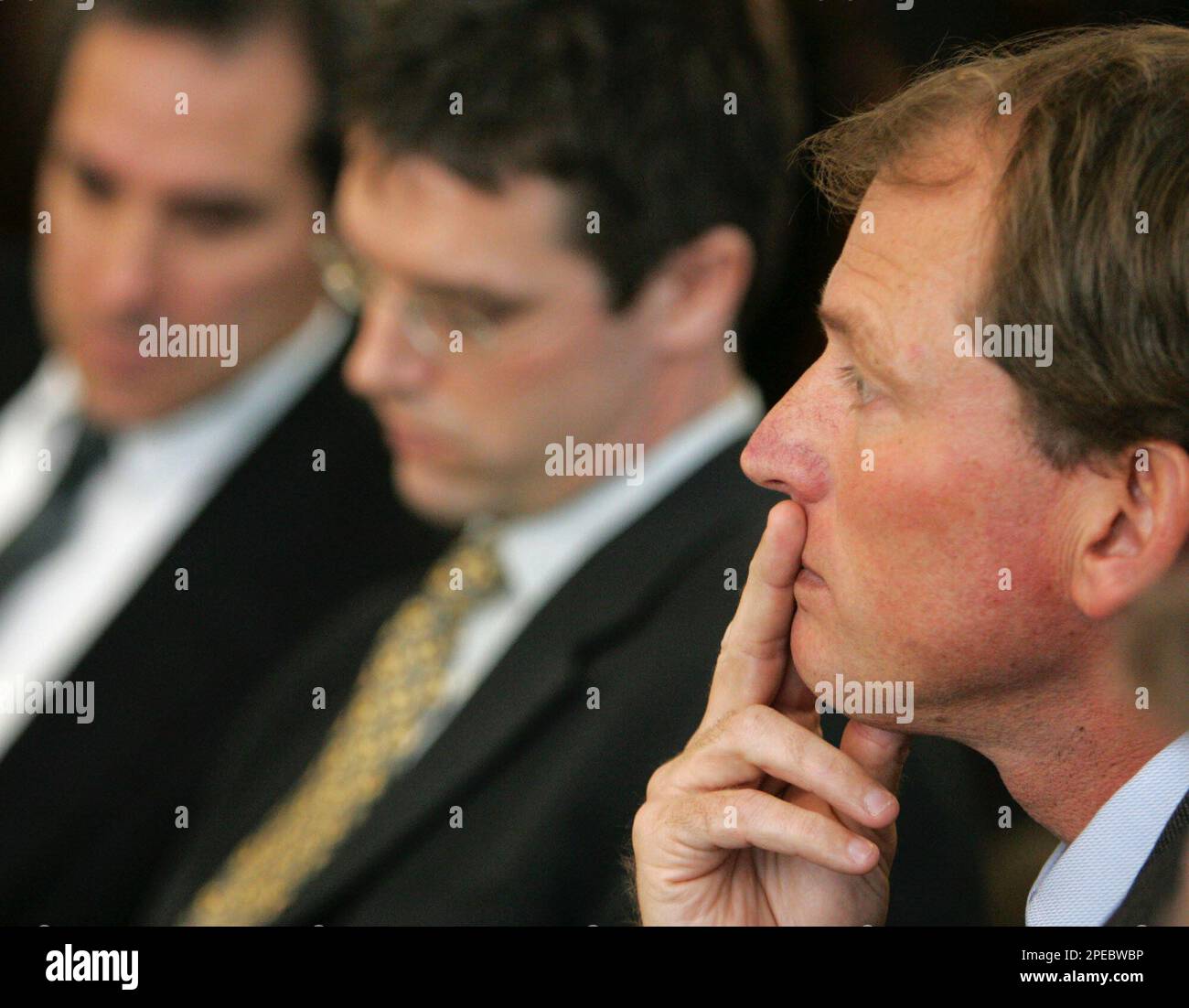Former University of Washington football coach Rick Neuheisel, right ...
