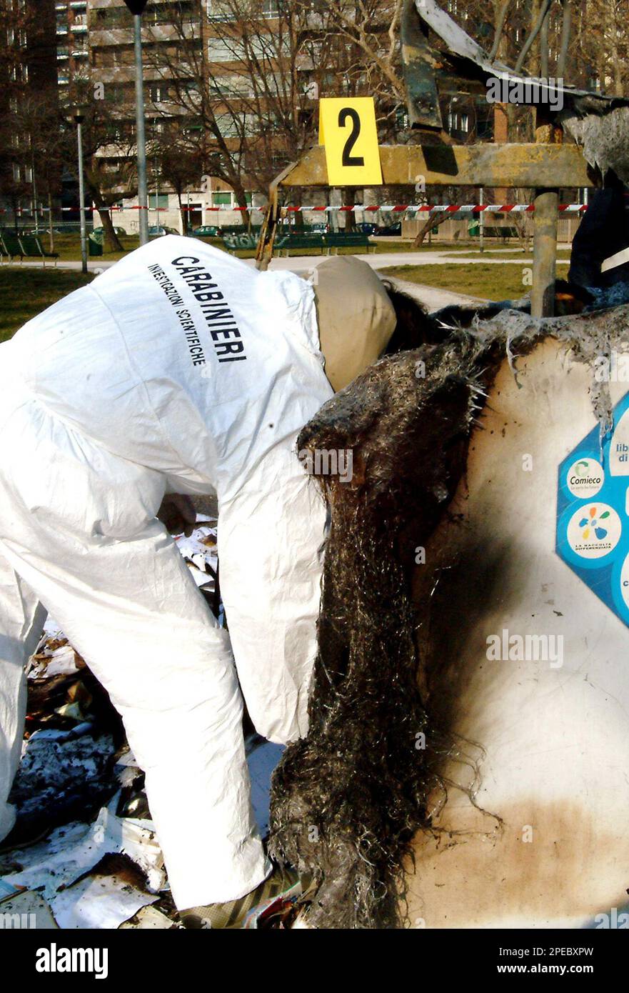 An italian Carabinieri paramilitary police officer inspects a wrecked ...