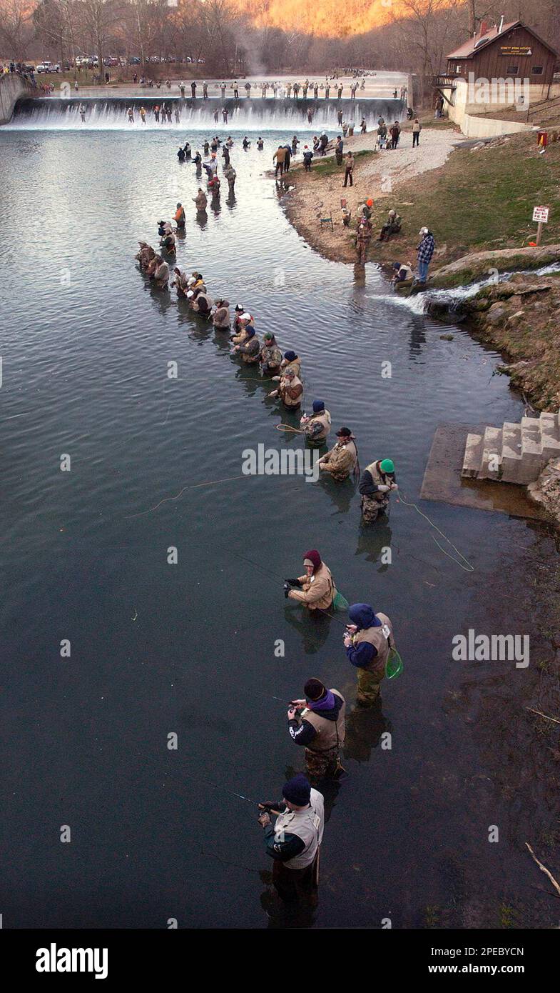 Fisherman line the banks at Bennett Springs State Park near Lebanon, Mo ...