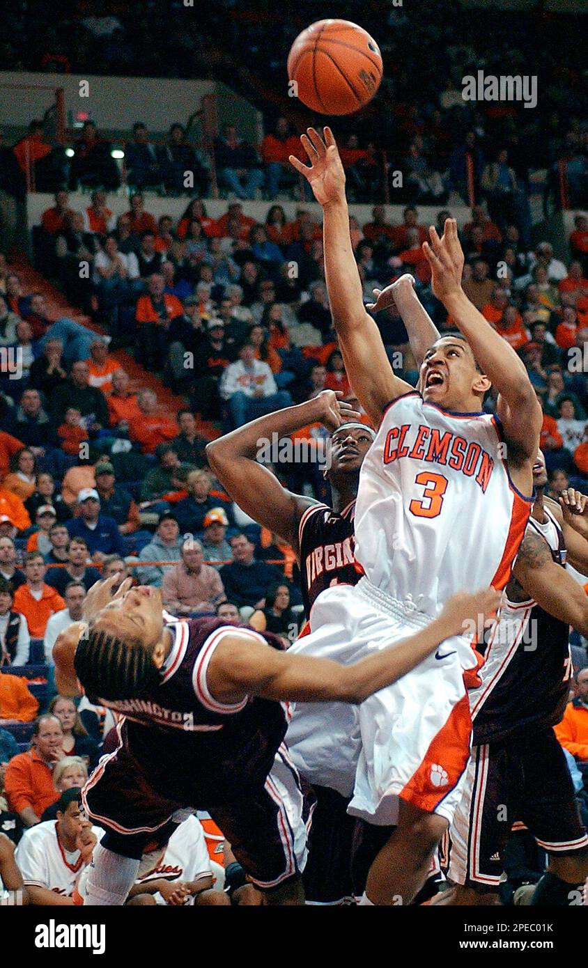 Virginia Tech's Deron Washington, left, is knocked over on a drive by ...