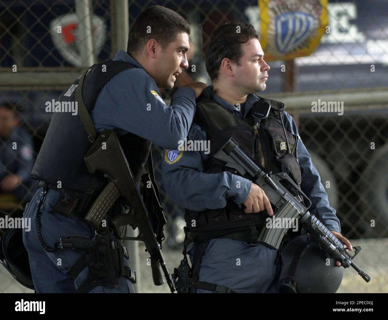 Federal police officers patrol the entrance to the federal police ...