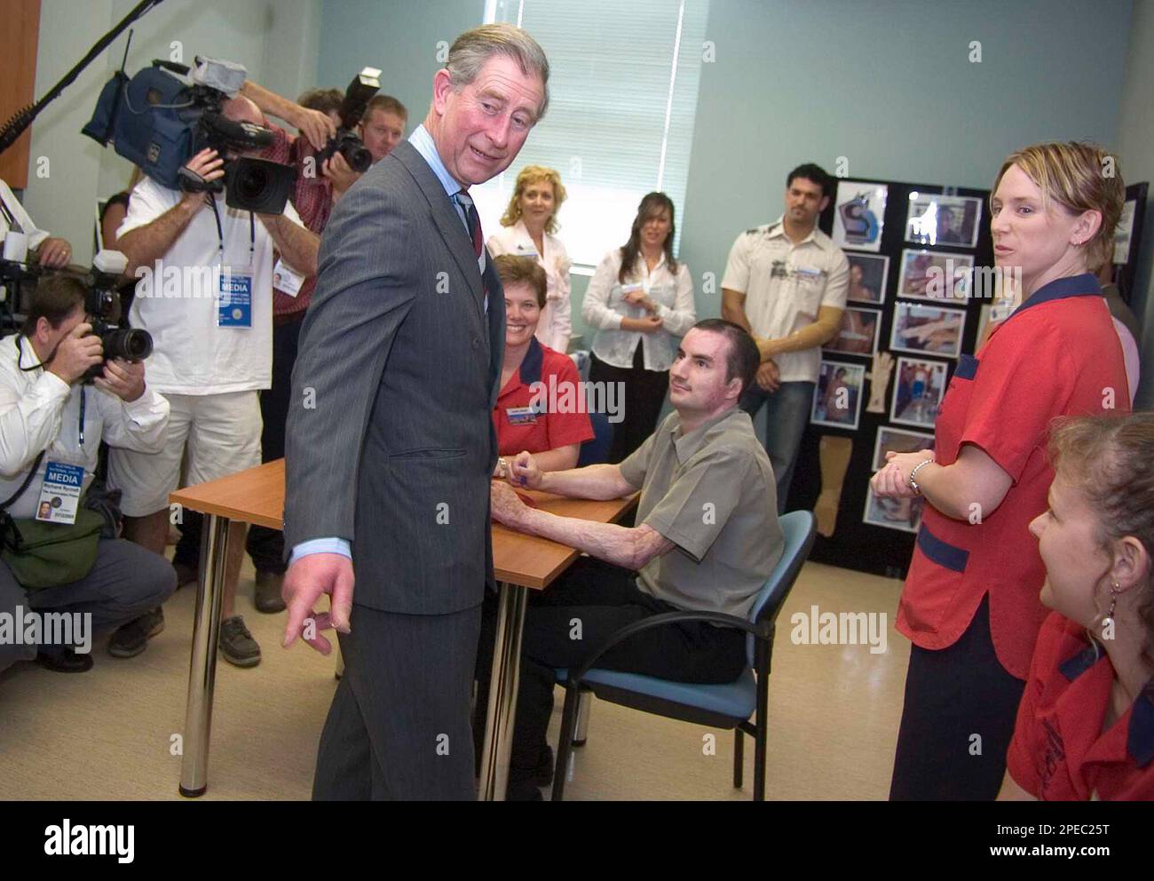 Britain's Prince Charles, center, visits Royal Perth Hospital burns ...