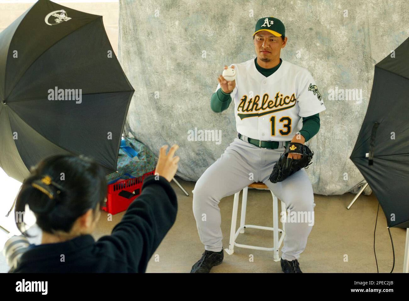 Oakland Athletics' pitcher Keiichi Yabu, right, of Japan, gets ...