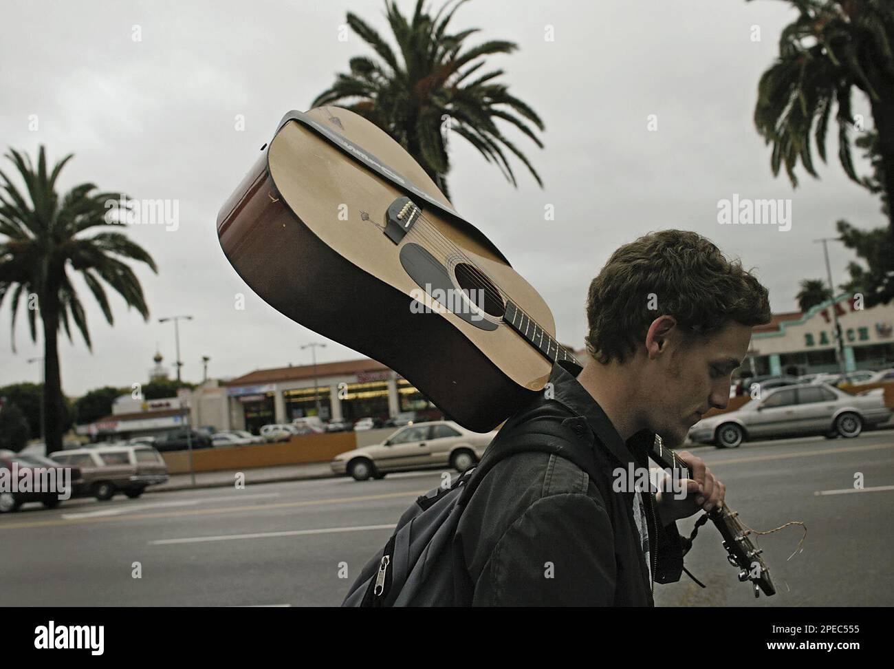 Andrew Stone, a homeless teenage guitarist walks on Sunset Boulevard ...