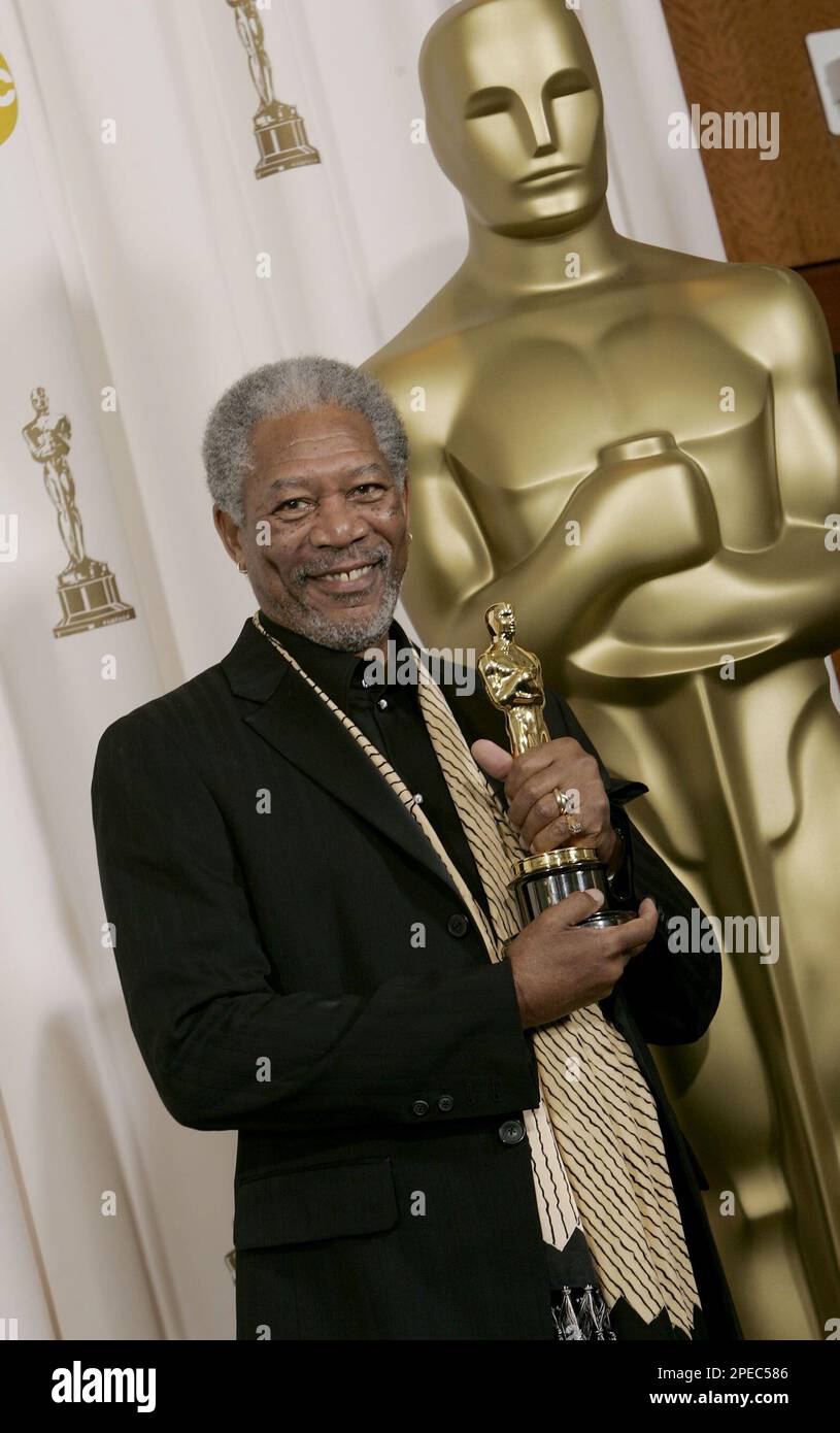 Actor Morgan Freeman poses with the Oscar he won for best supporting ...