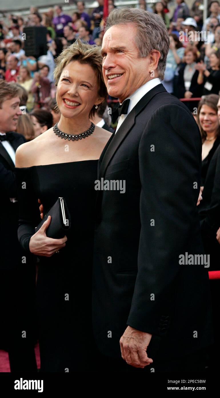 Annette Bening and her husband Warren Beatty arrive for the 77th Oscars ...