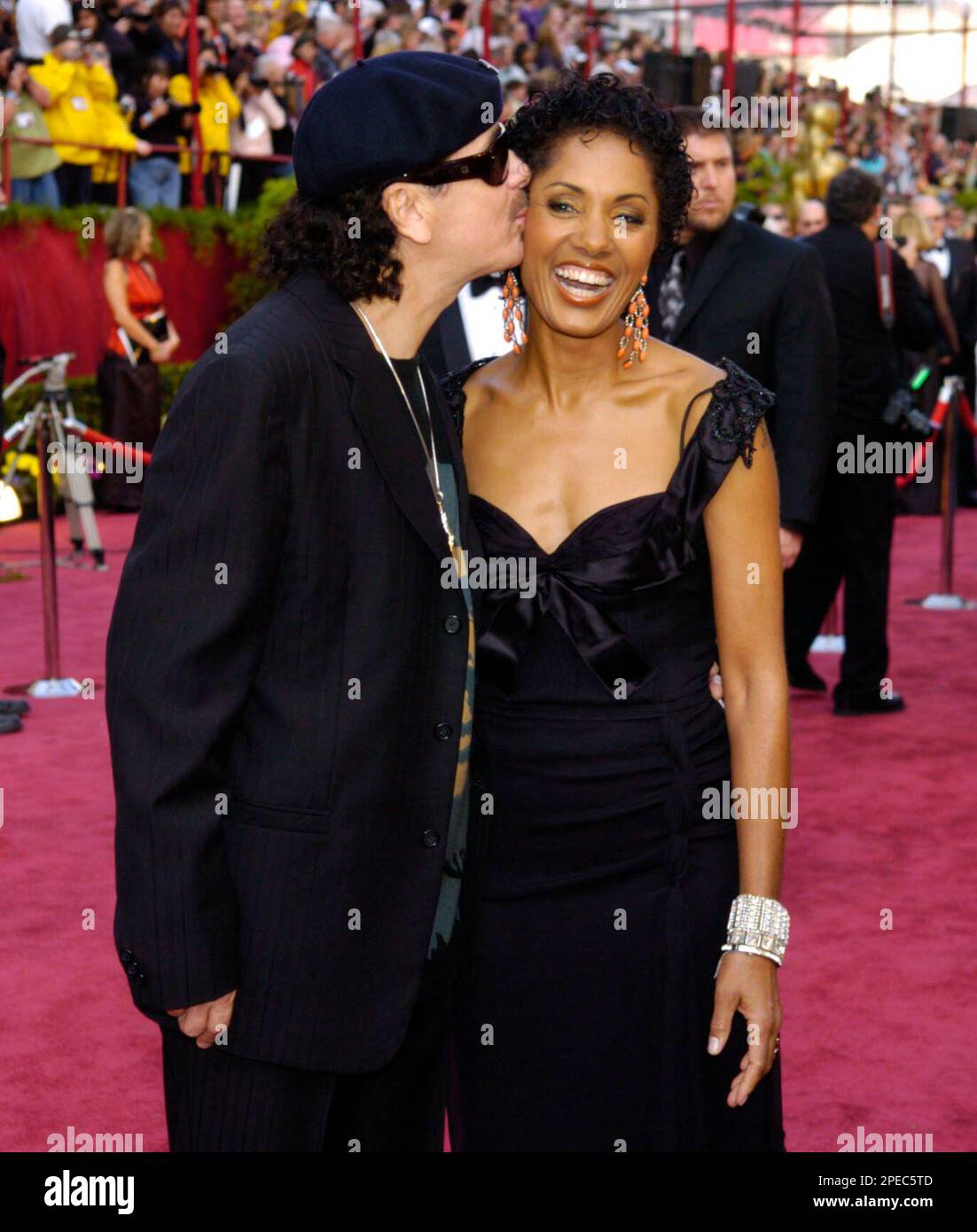 Musician Carlos Santana and his wife Deborah arrive for the 77th ...