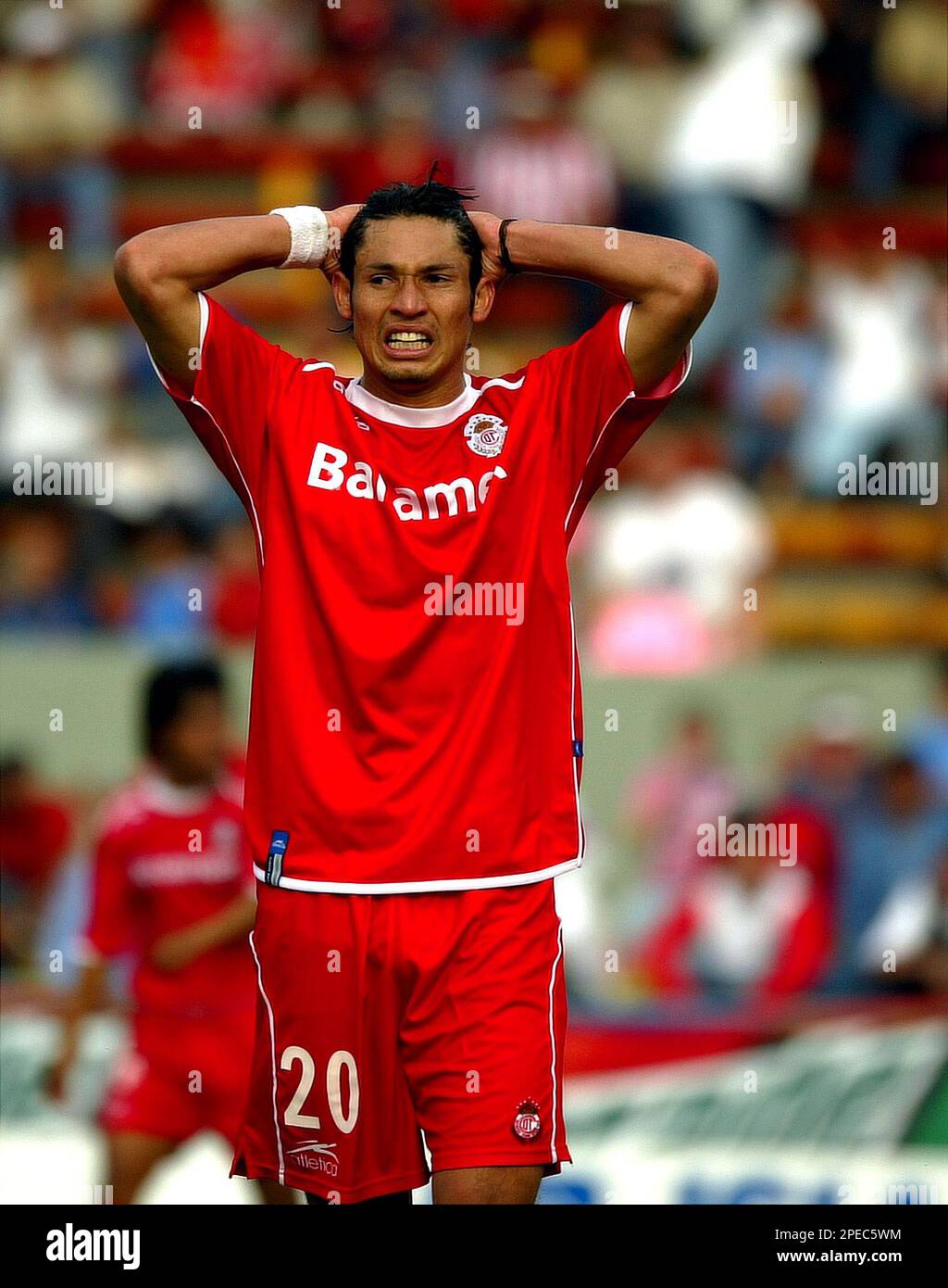 Toluca player Fabio Escobar reacts after missing a shot during their ...