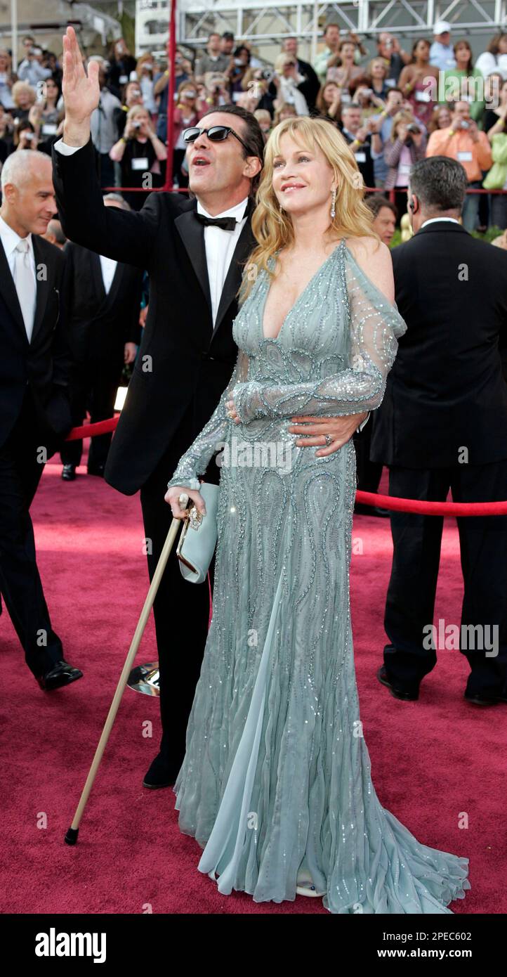 Melanie Griffith, who is walking with a cane, arrives with her husband ...