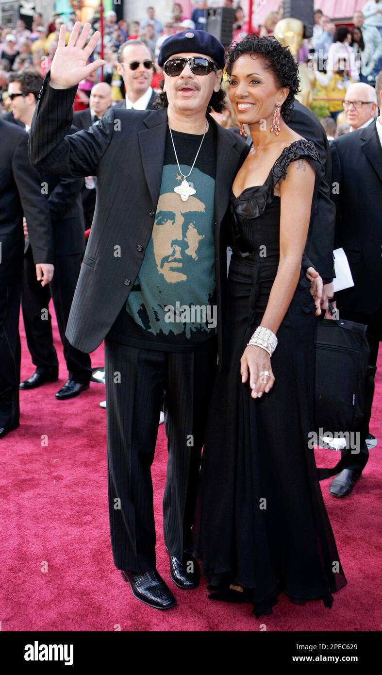 Musician Carlos Santana and his wife Deborah arrive for the 77th ...