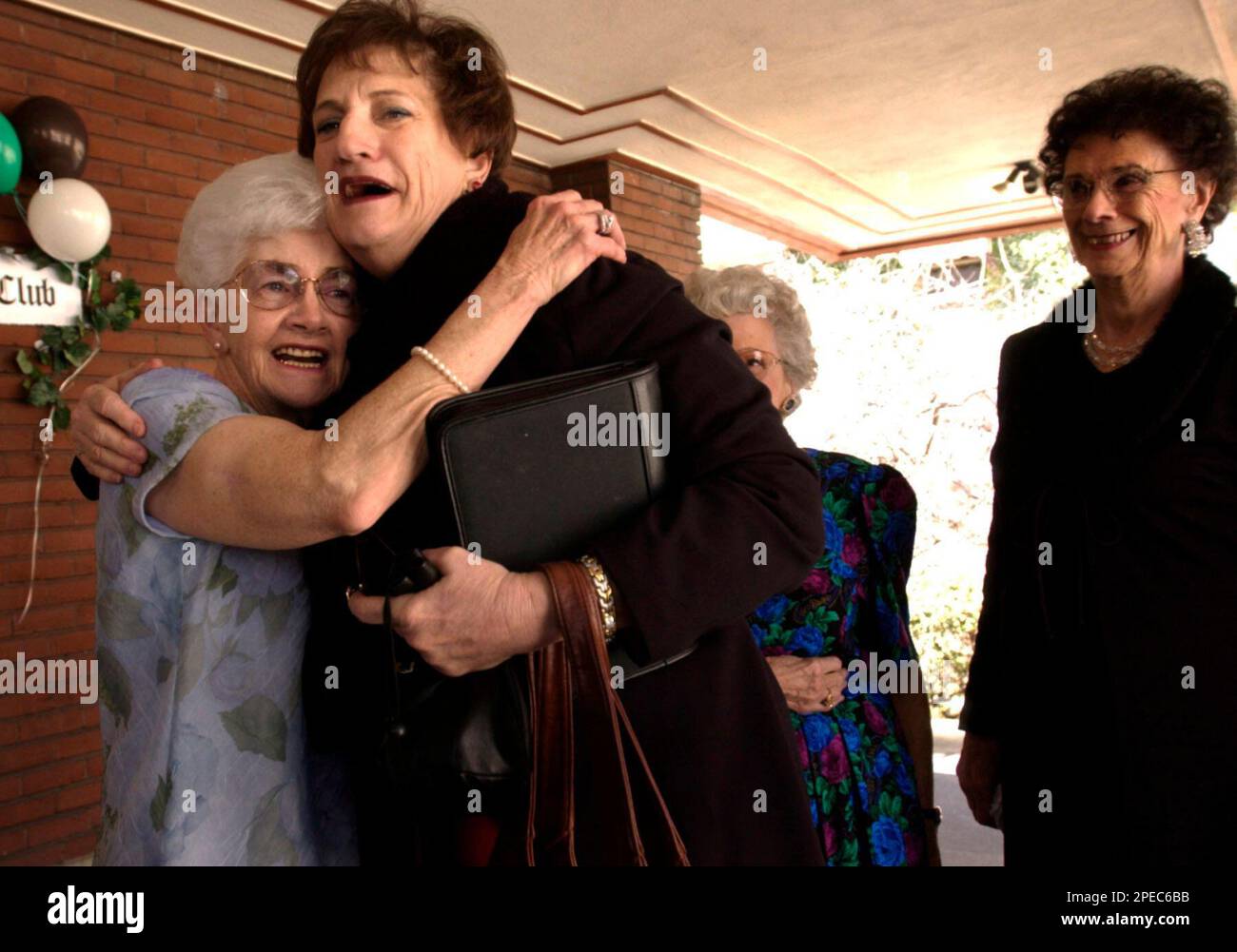 Literary Club President Kathryn Major is hugged by club member Joan ...