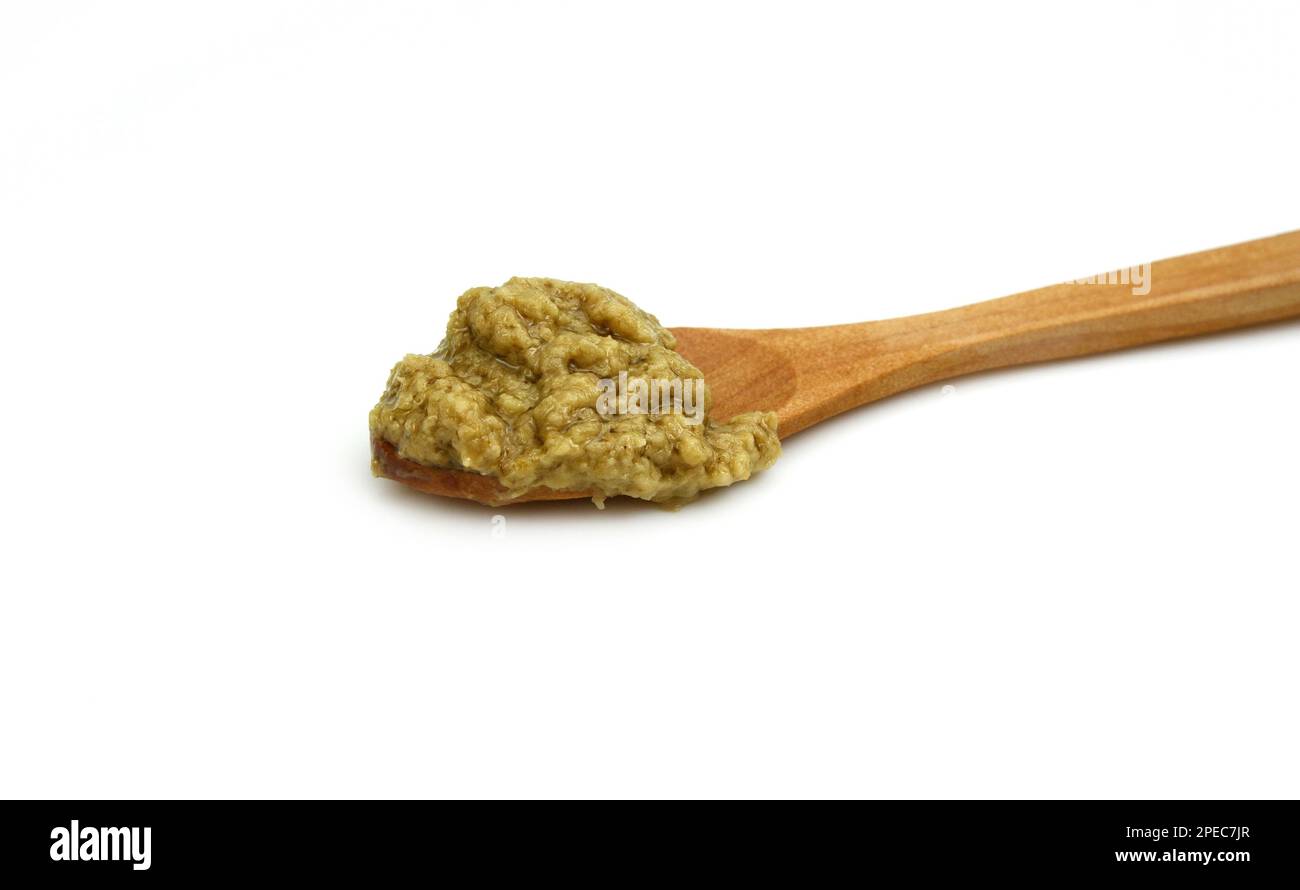 Eggplant dip in a wooden spoon isolated on white background. Eggplant ...