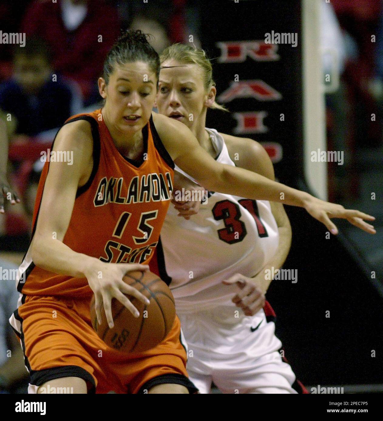 Oklahoma State's Christian Hood (15) is guarded by Texas Tech's Cisti ...