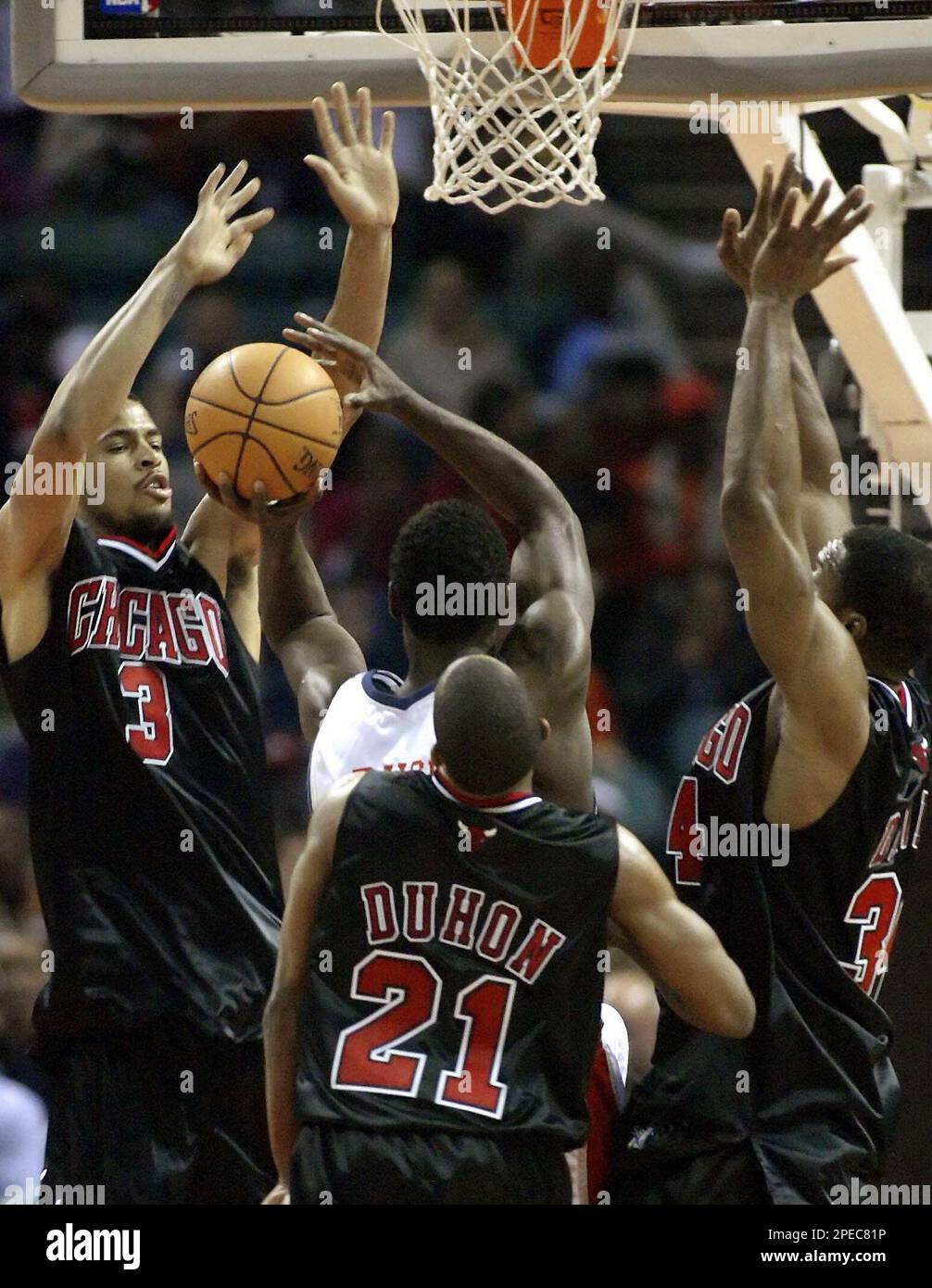 Charlotte Bobcats' Emeka Okafor, center, is surrounded by Chicago Bulls ...