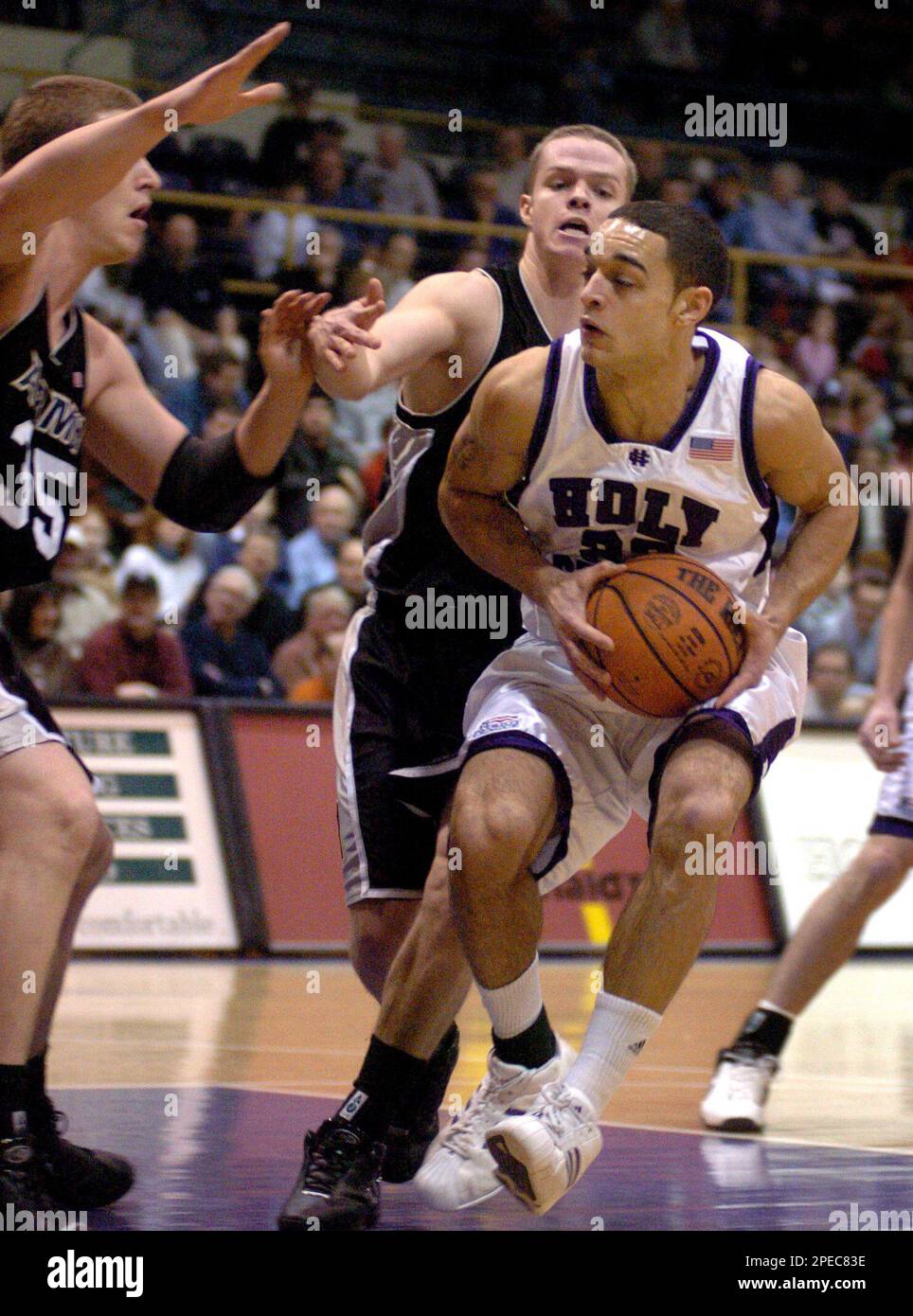 Holy Cross' Greg Kinsley, right, works under pressure from Army's Erik ...