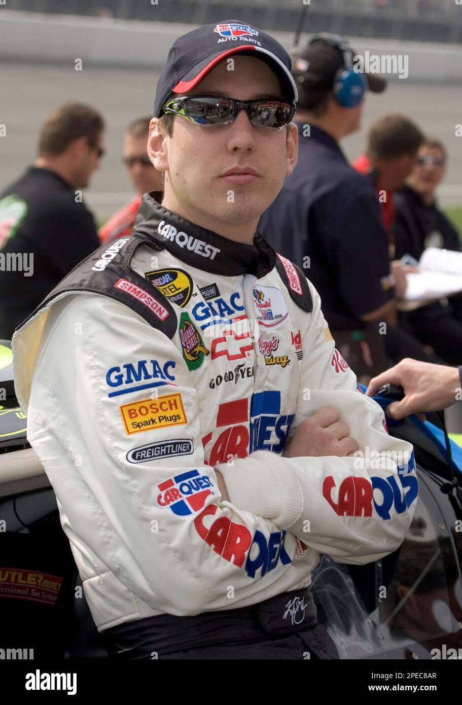 Kyle Busch, 19, waits by his car before qualifying for the pole in the ...