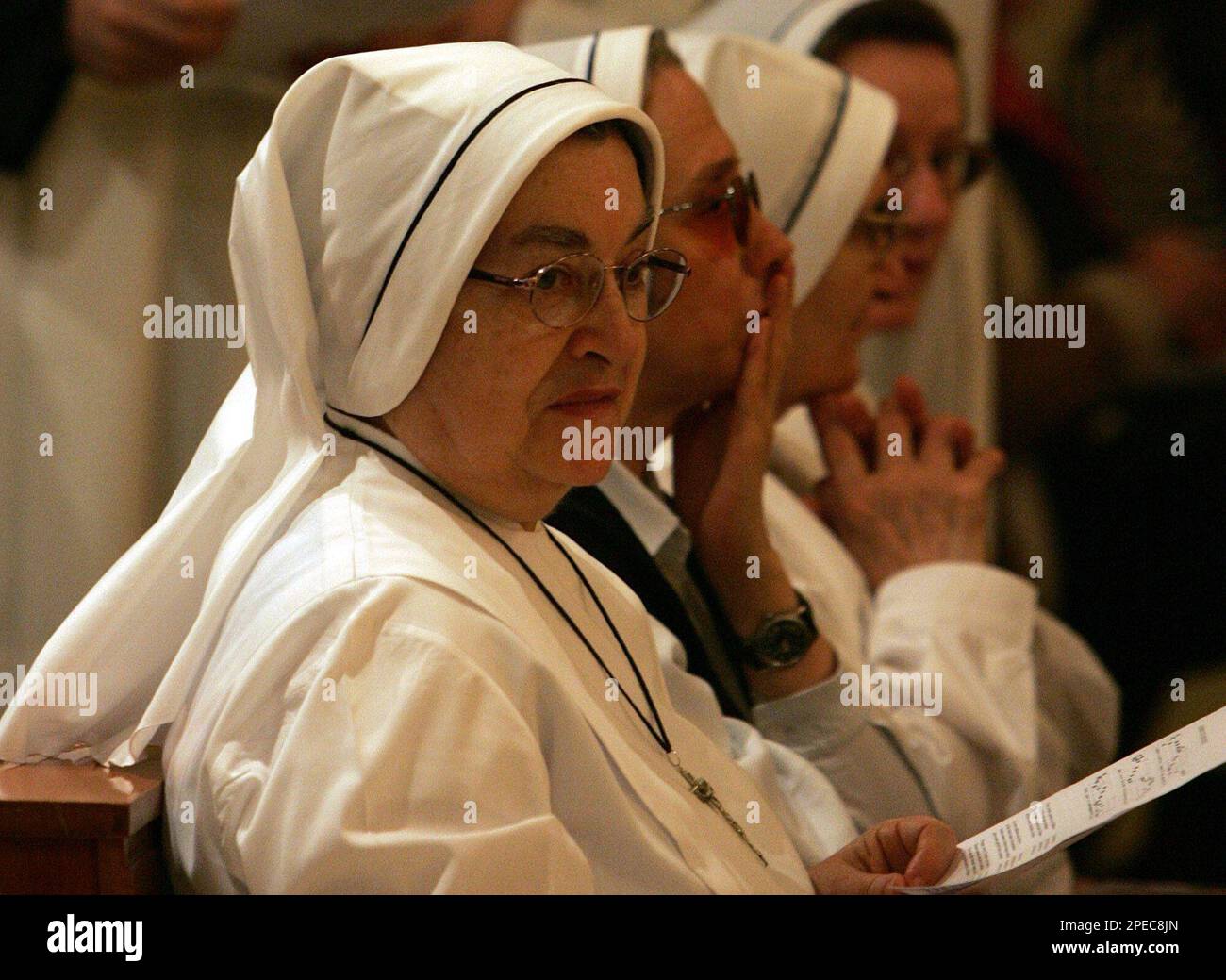 Four nuns sit together as they wait for a special mass held at the ...