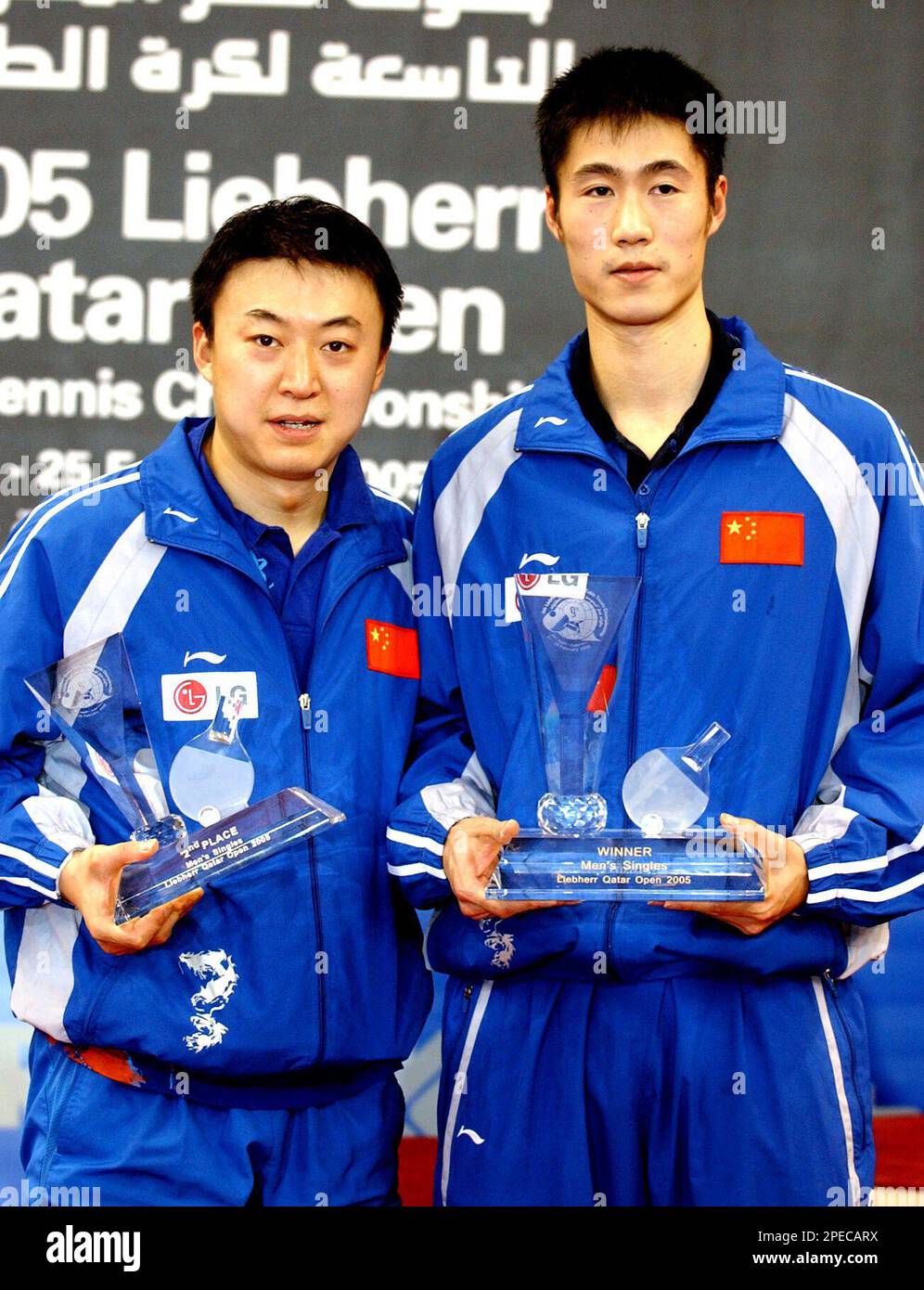 Qatar Open Table Tennis men's singles champion Wang Liqin, right, of China and his second-placed ...