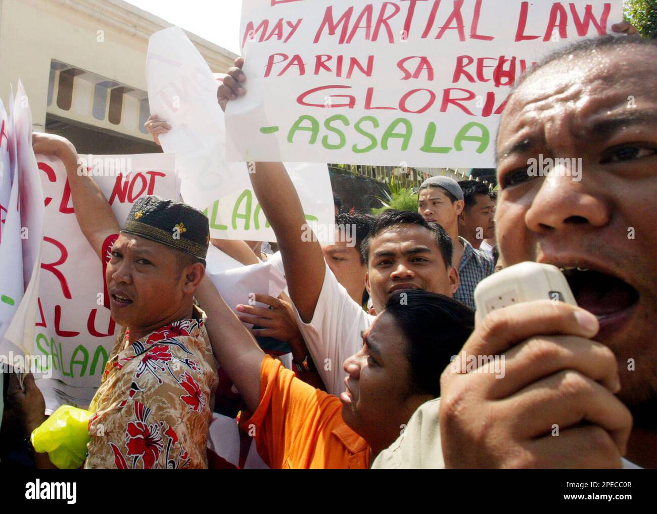 Filipino Muslims shout slogans during their rally after attending their ...