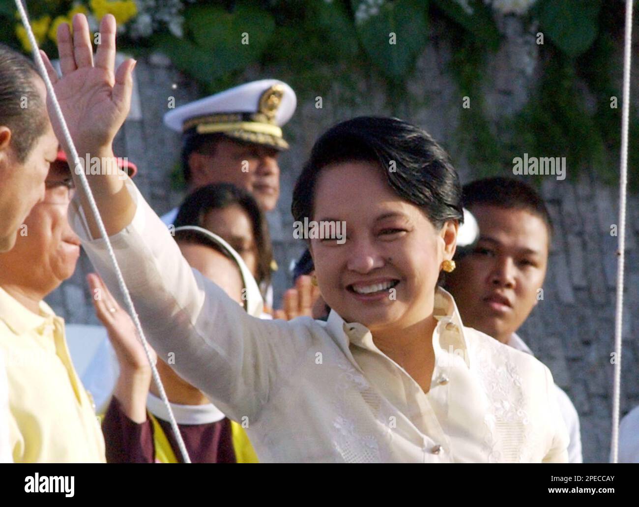 Philippine President Gloria Macapagal Arroyo waves to the crowd during ...